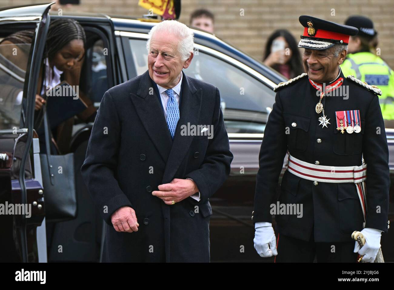 Britain's King Charles III, center, arrives to inaugurate the ...