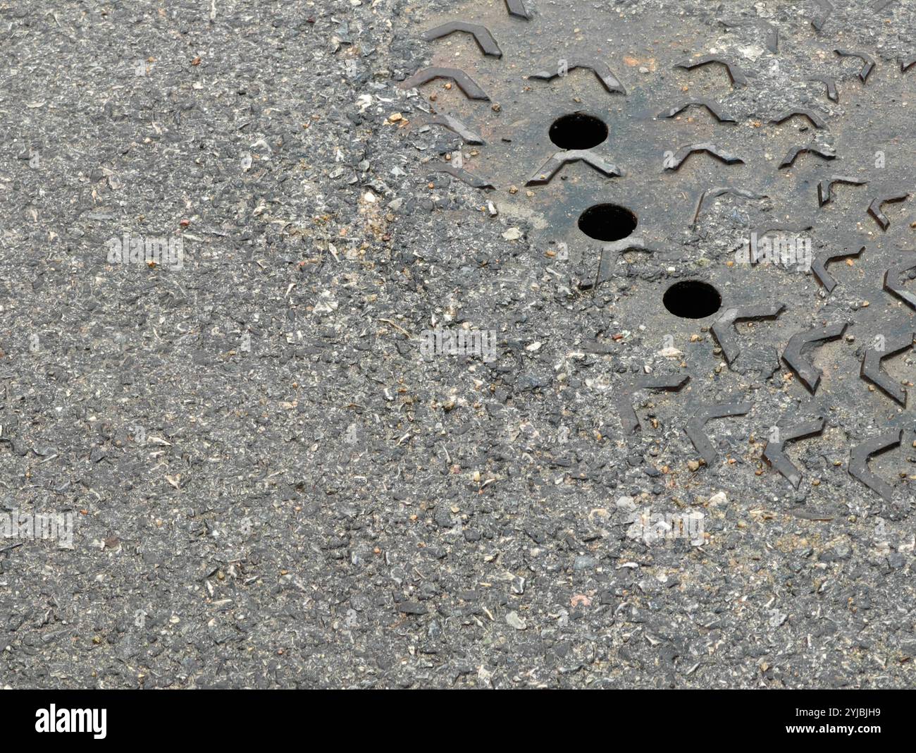 Rainy Street Infrastructure: Manhole Cover with Three Drainage Holes ...
