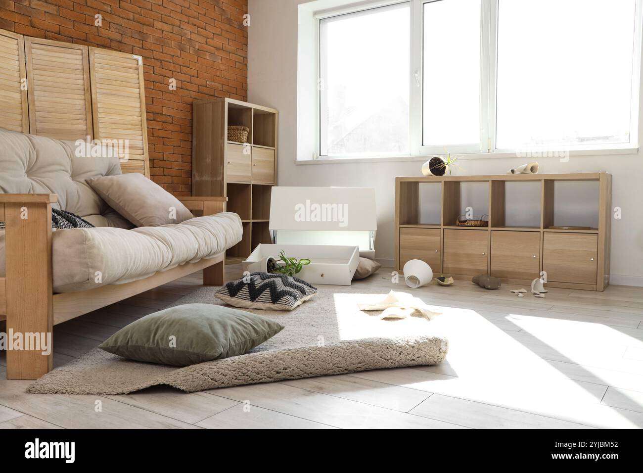 Interior of messy living room with broken things after earthquake Stock ...