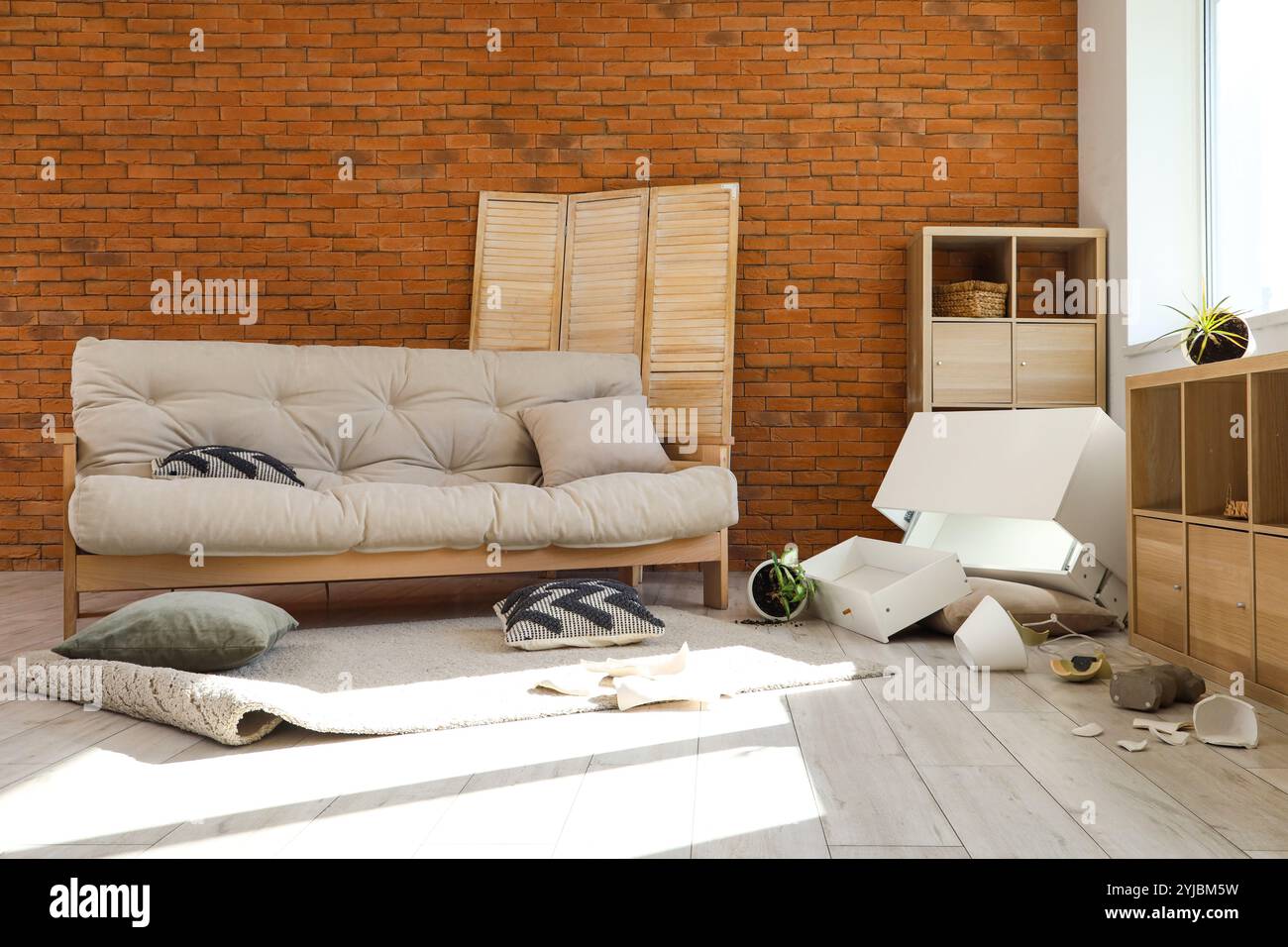 Interior of messy living room with broken things after earthquake Stock ...