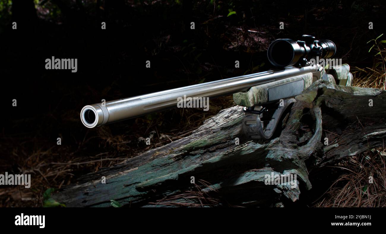 Modern rifle and scope for hunting that is an inline muzzlelader Stock ...