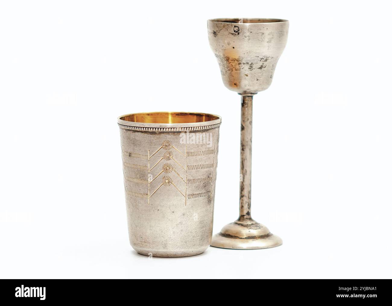 Small silver gilded antique glass and goblet on high stem with ...