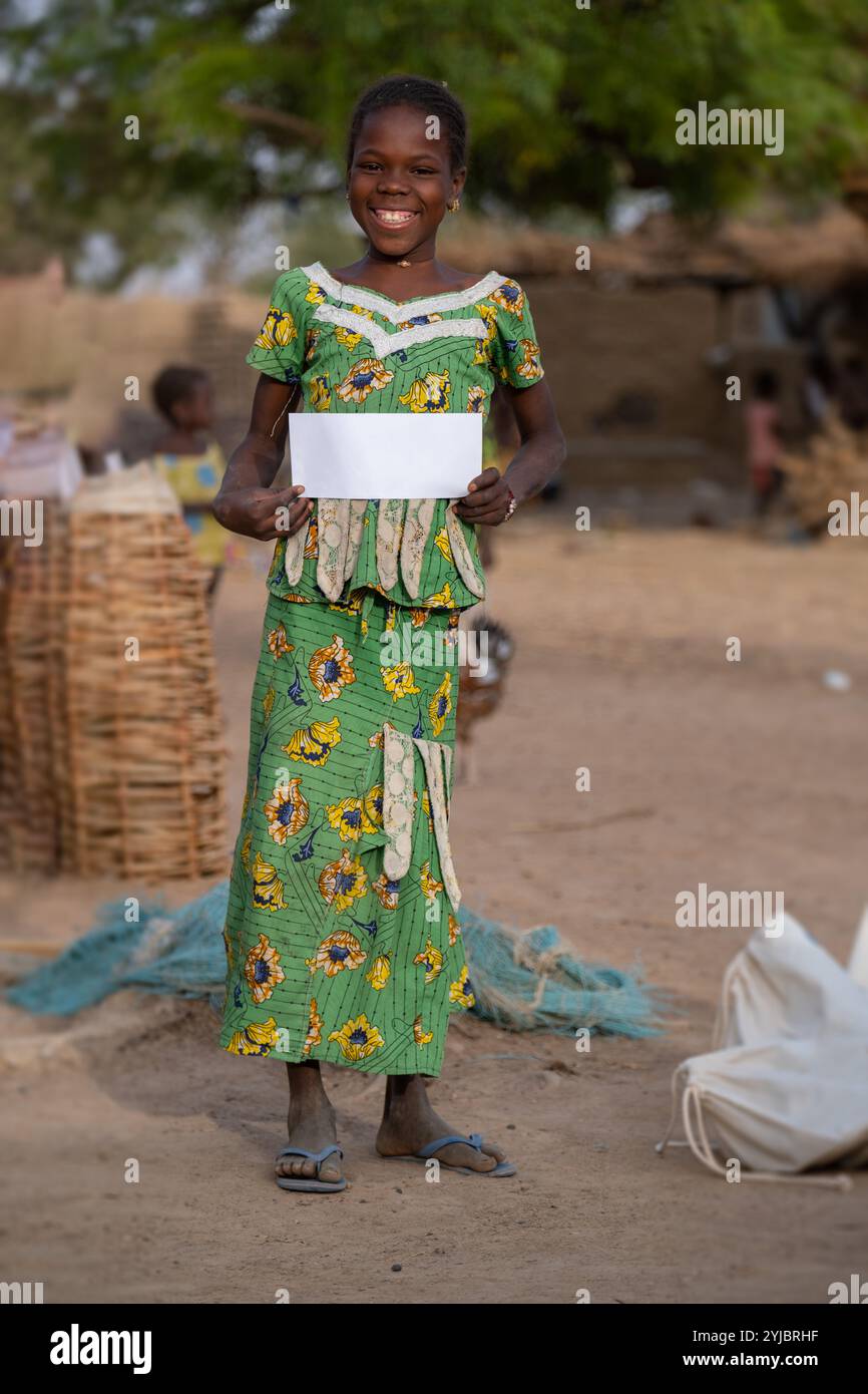 Happy African girl who got help Stock Photo - Alamy