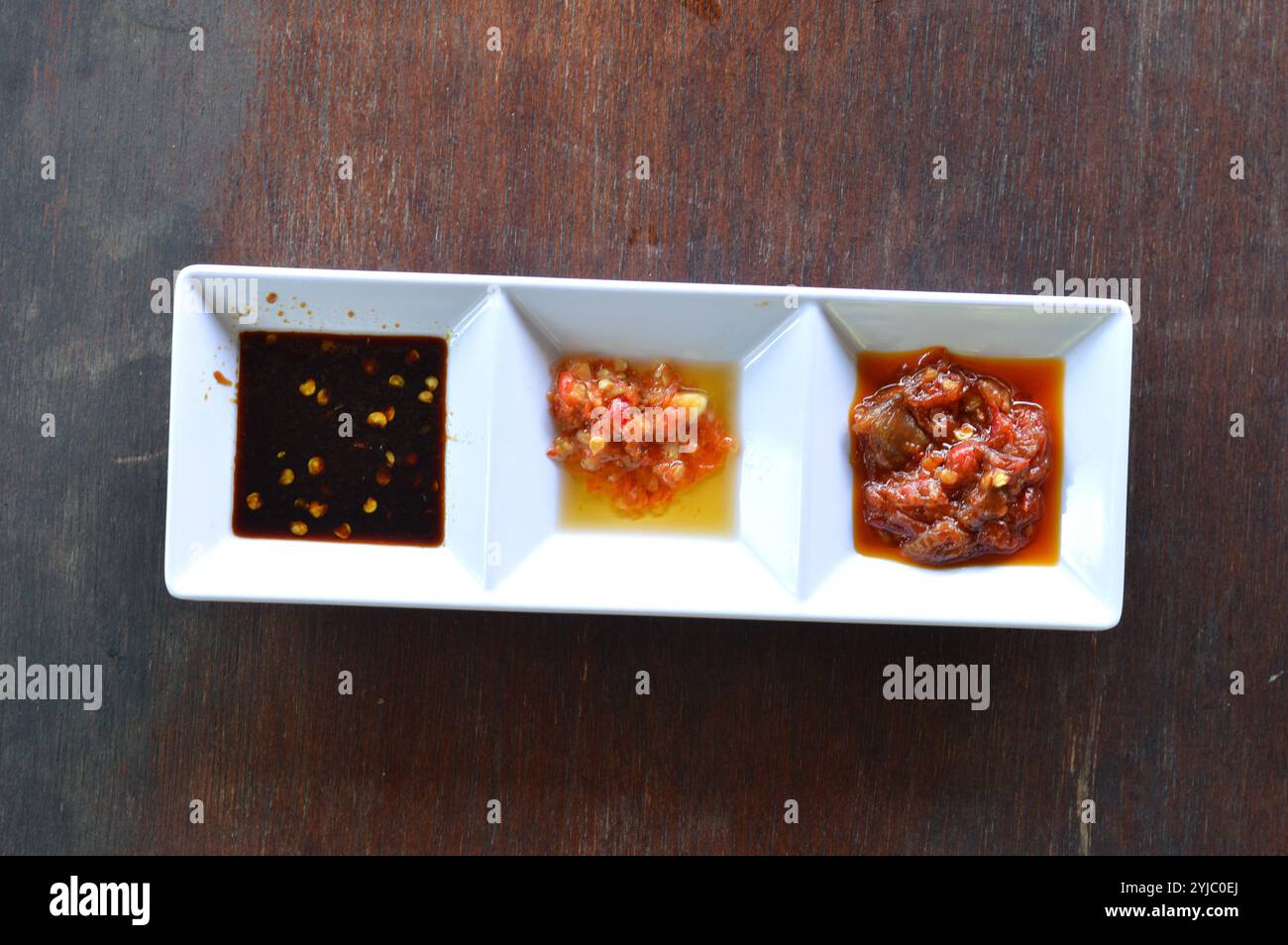 three types of chili sauce in white bowl Stock Photo - Alamy