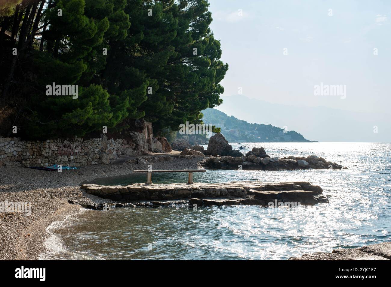 Sunny beaches of Stanići, Croatia, with clear azure waters and sandy ...