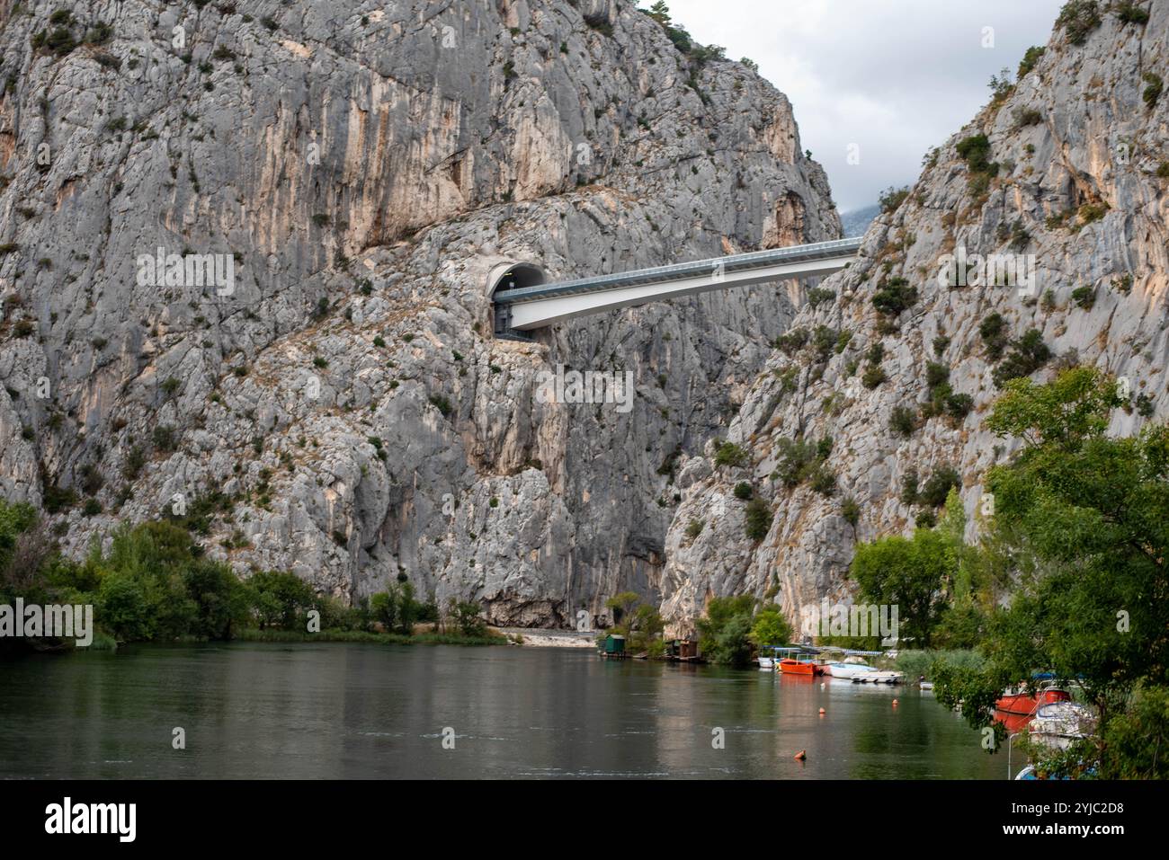 Omis bridge spans the Cetina River in Croatia, featuring scenic tunnels ...