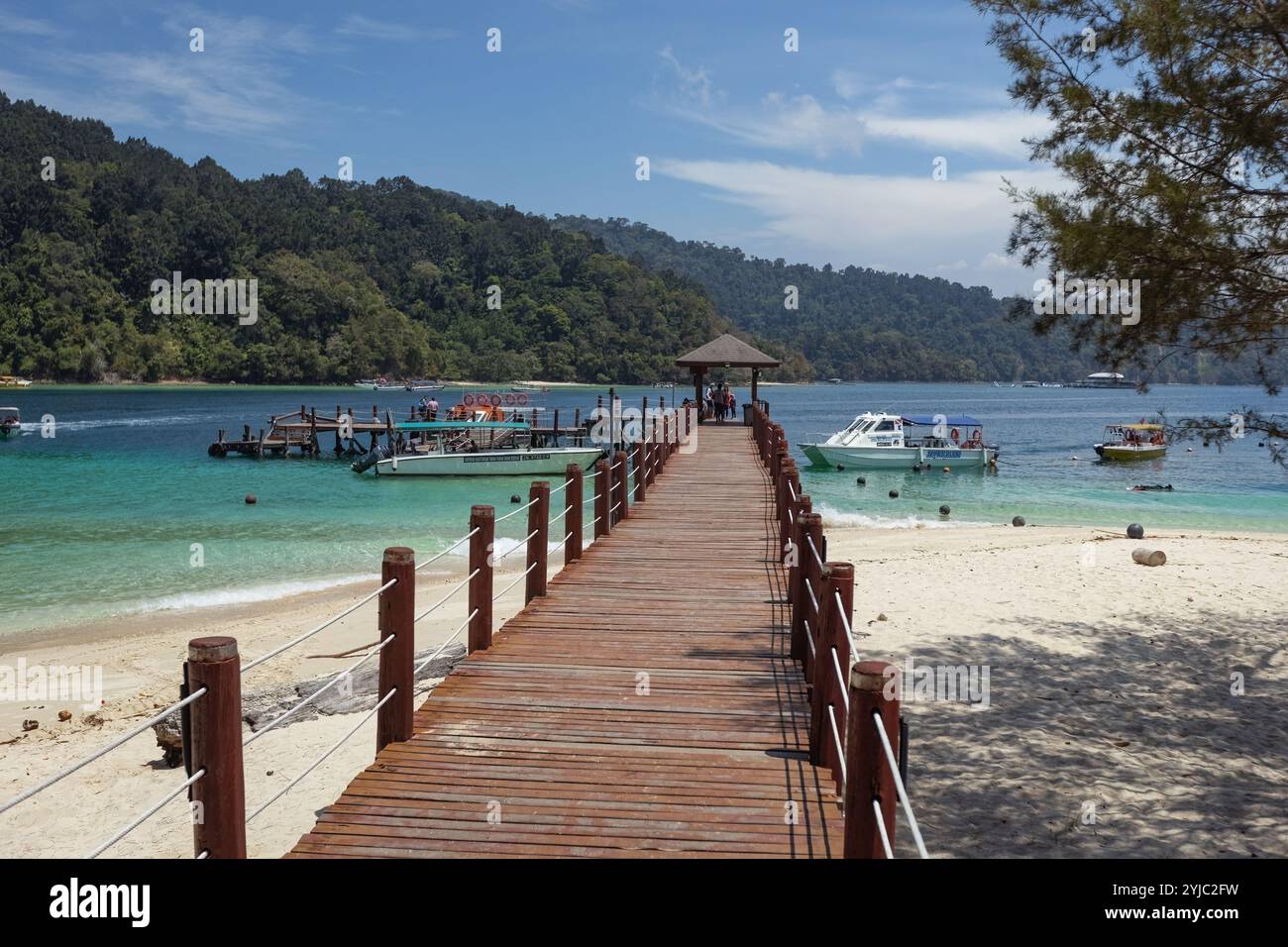 Wooden pier and boats at Sapi island KOta Kinabalu, Sabah, Malaysia ...