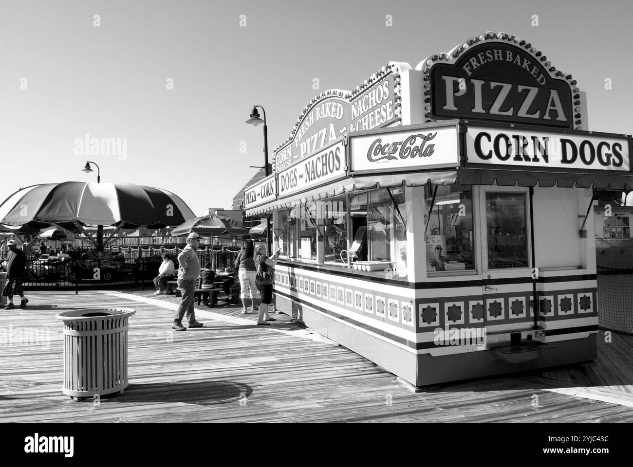 Visitors buying food from a vendor at the Pavilion Nostalgia Park in ...