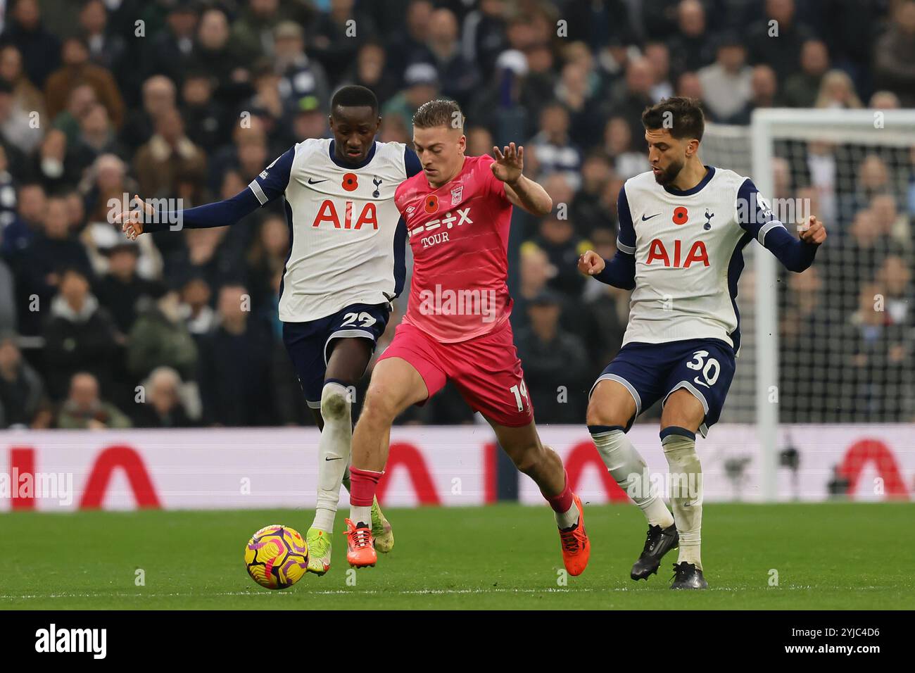 Liam Delap of Ipswich Town in action with Pape Matar Sarr and Rodrigo ...