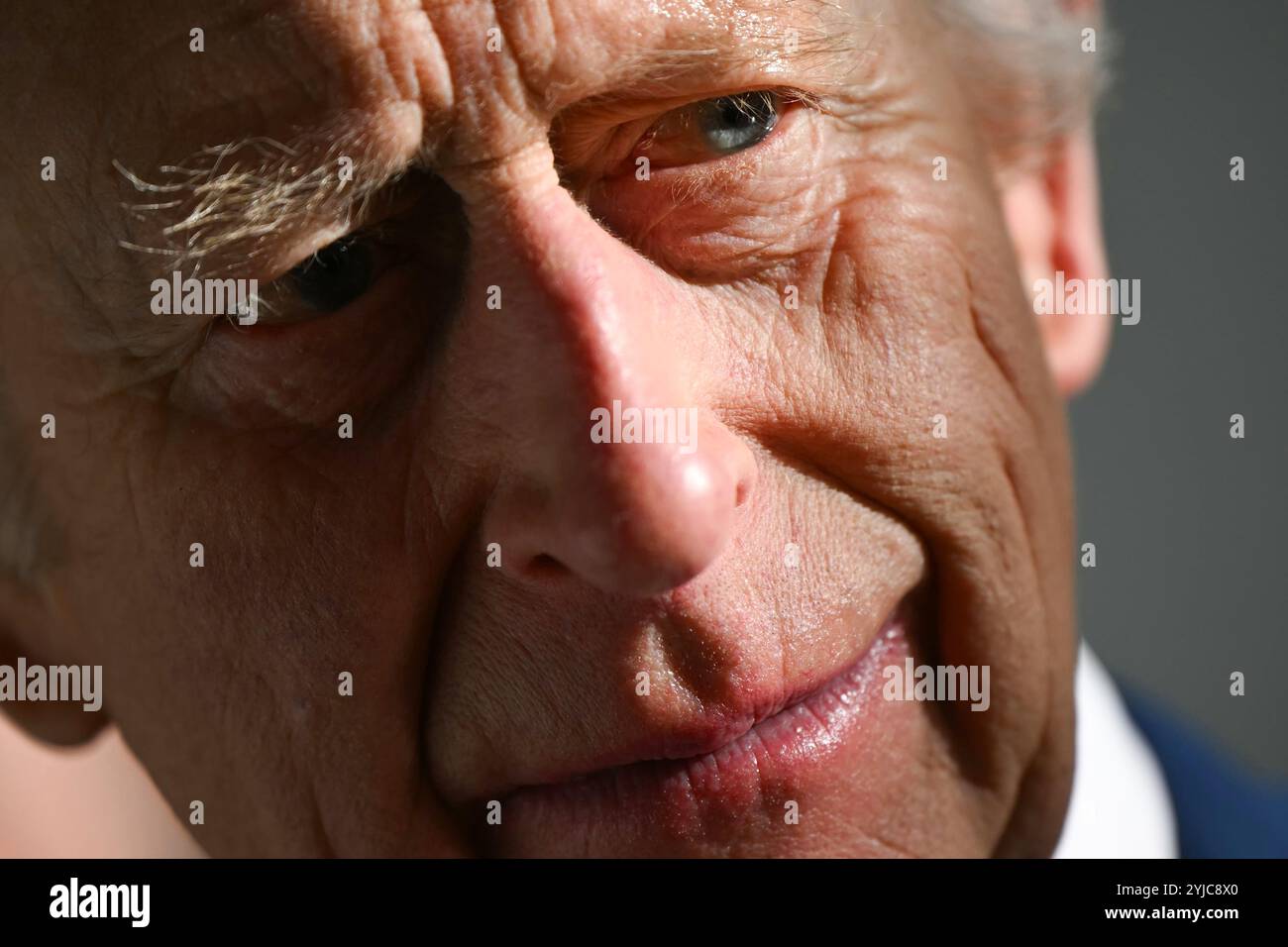 King Charles III reacts as he visits the first Coronation Food Hub in ...