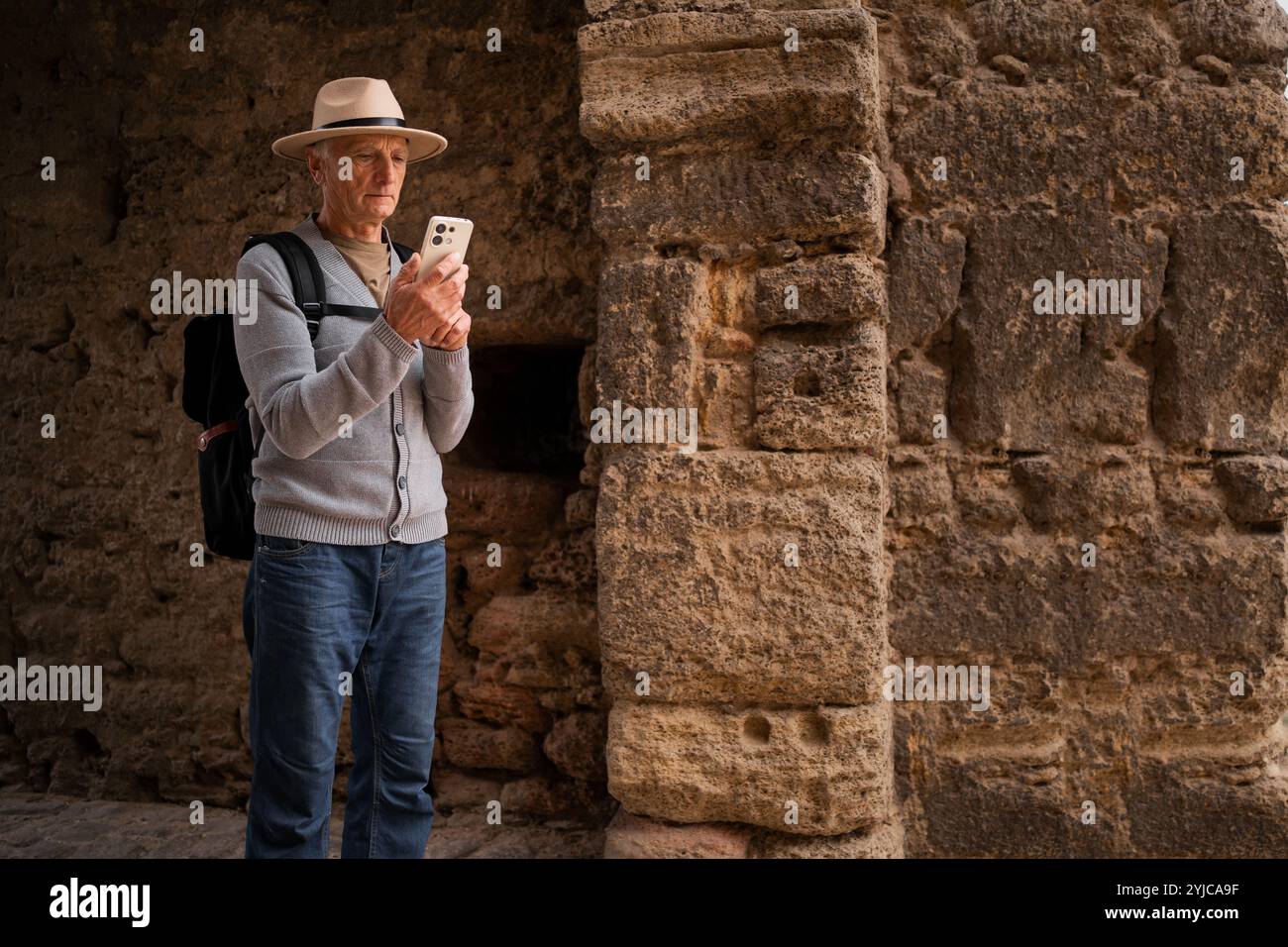 Retired traveler takes photo inside ancient fortress walls Stock Photo ...