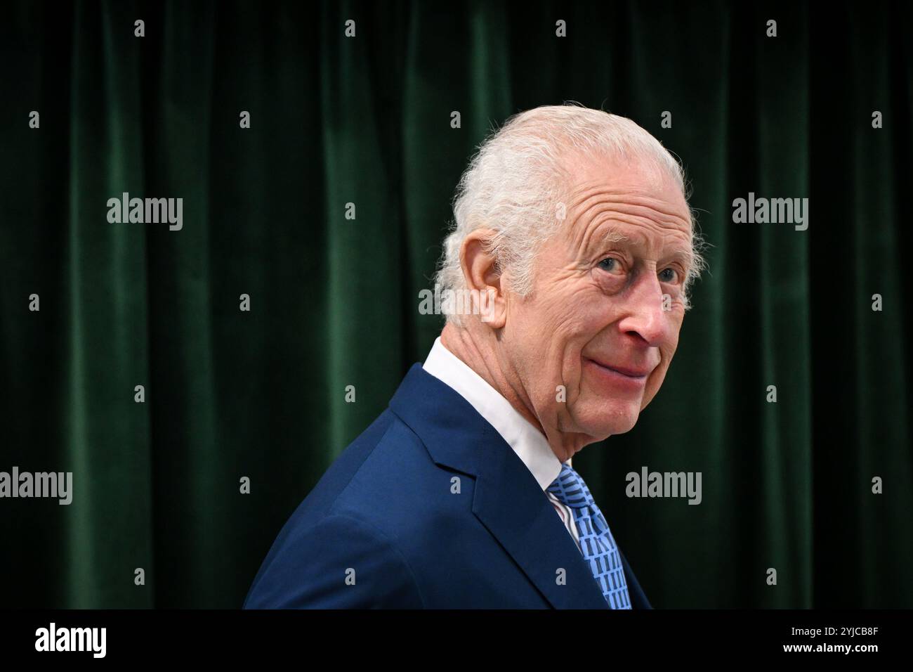 King Charles III reacts as he visits the first Coronation Food Hub in ...