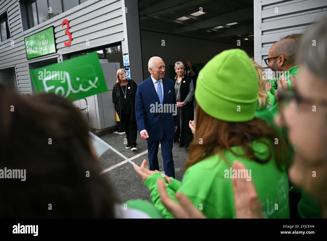King Charles III speaks with members of staff as he leaves the first ...