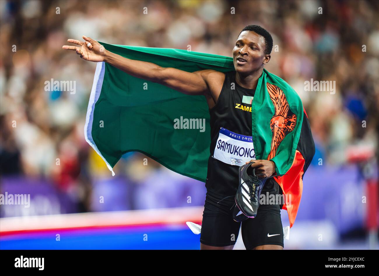 Muzala Samukonga celebrating her victory with her country's flag at the ...