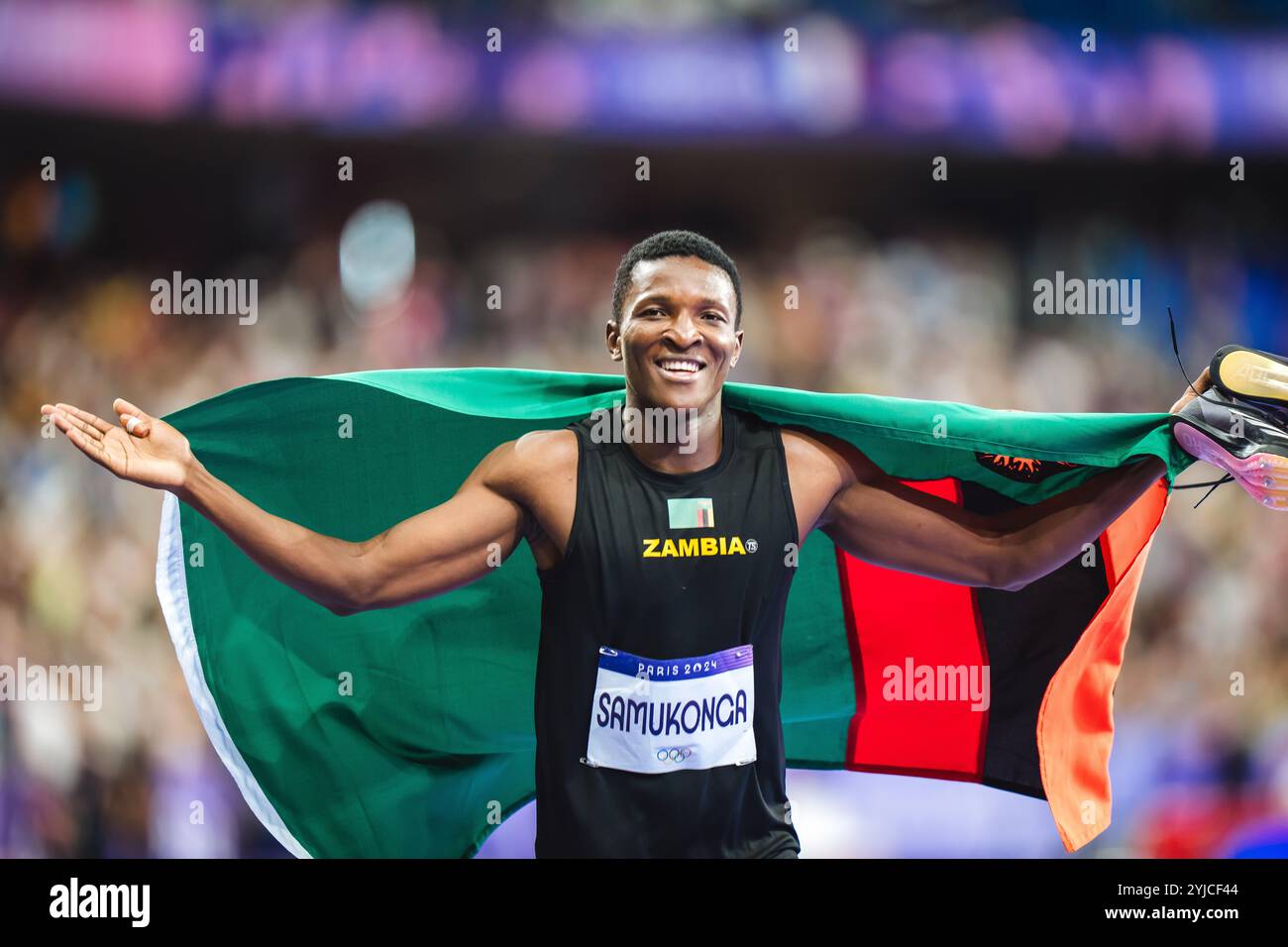 Muzala Samukonga celebrating her victory with her country's flag at the ...