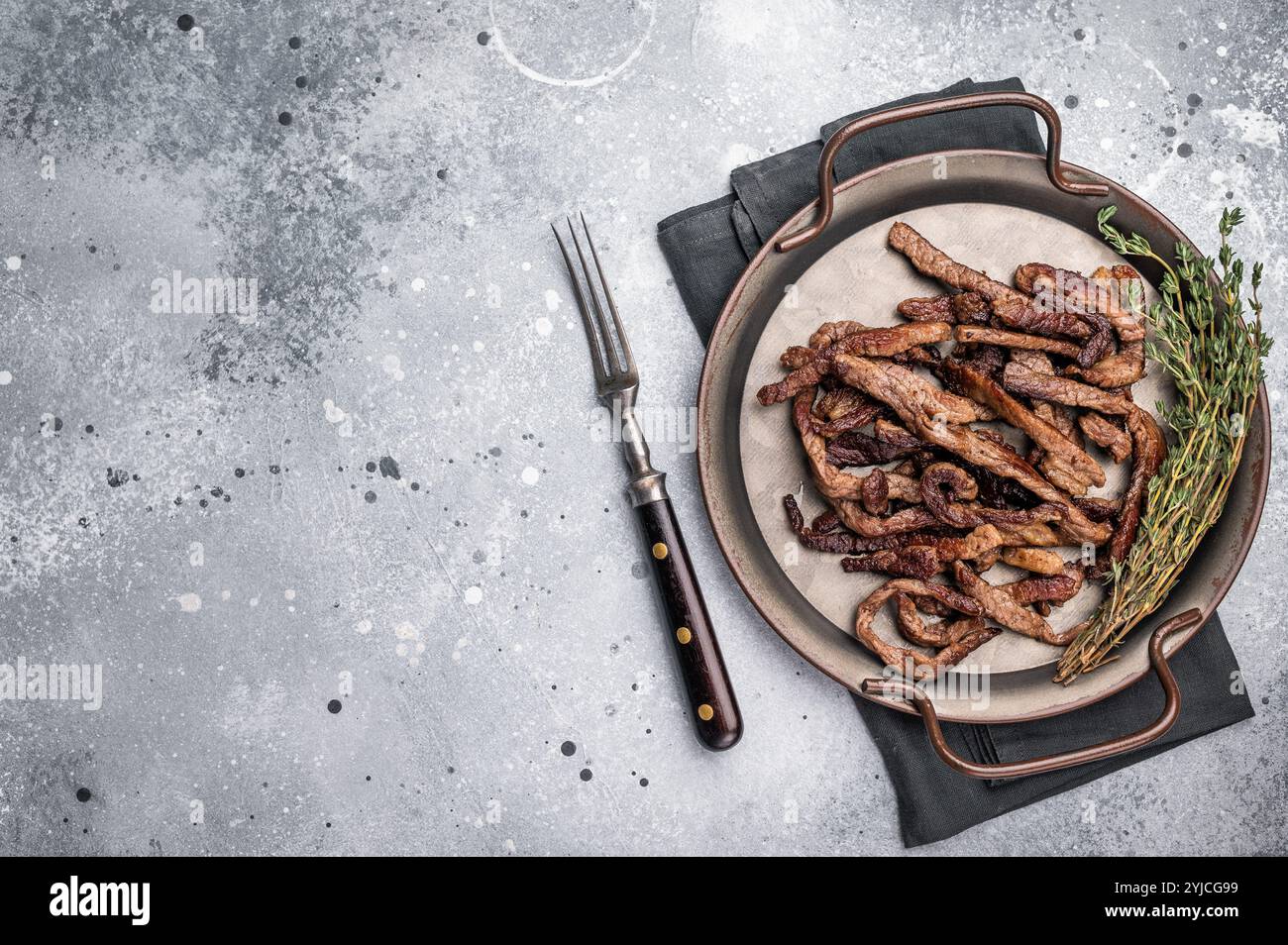 Deep fried beef tender strips, sliced meat in a tray. grey background ...