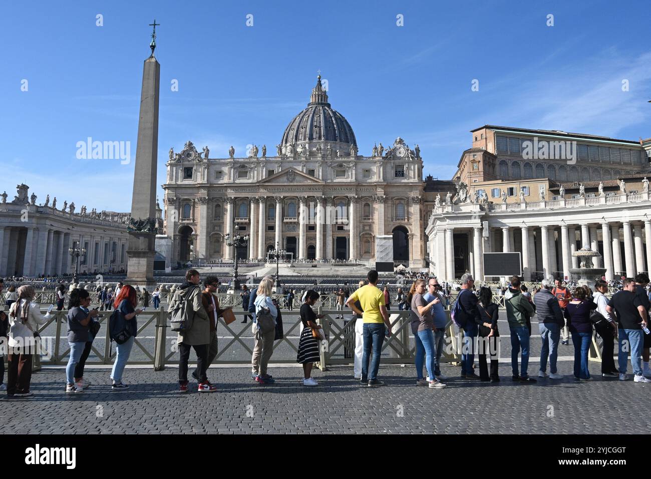 Vatican City - November 5, 2024: Tourists stand in a long line to the ...