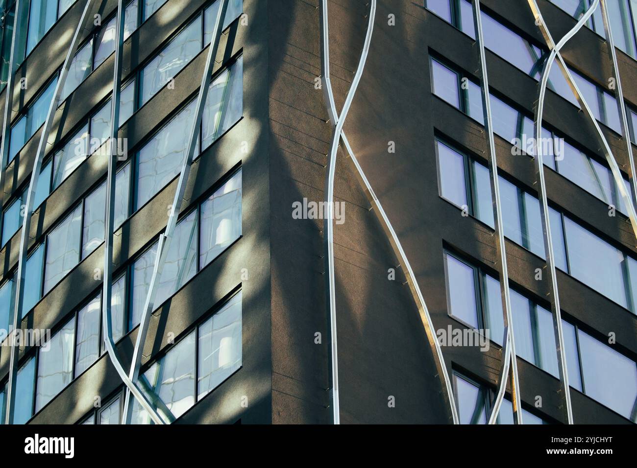 Combination of metal and glass wall material. Steel facade on columns ...