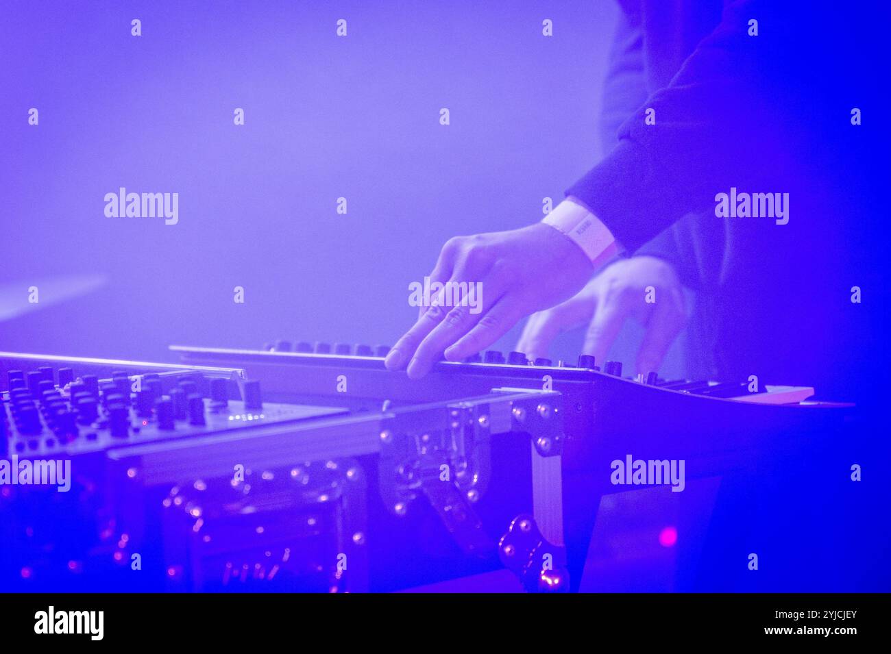 Hands of a DJ at work live on stage Stock Photo - Alamy