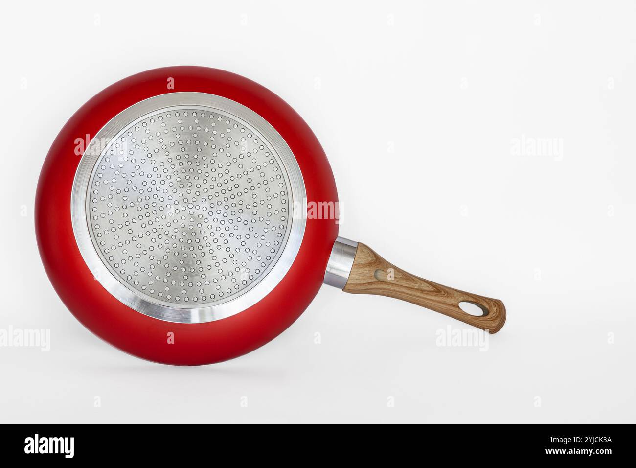 frying pan made from red ceramic on a white background. long lasting ...