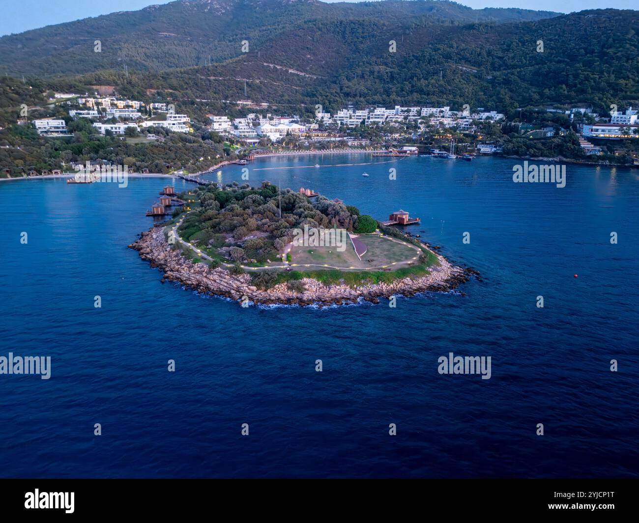 Island with cabanas and resorts in the sea. High angle view from the ...