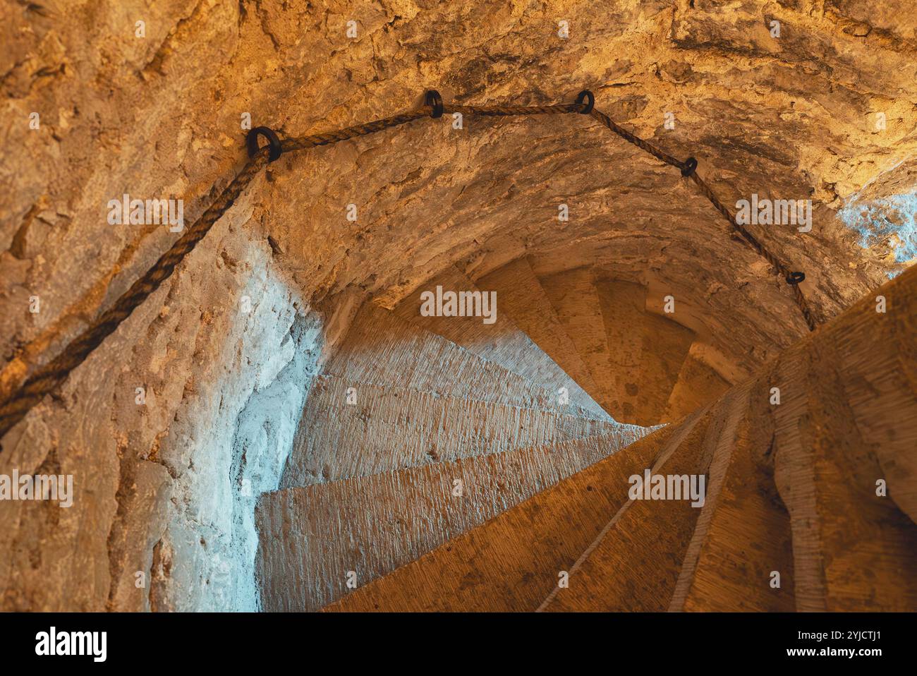 An ancient twisted stone staircase leading down Stock Photo - Alamy