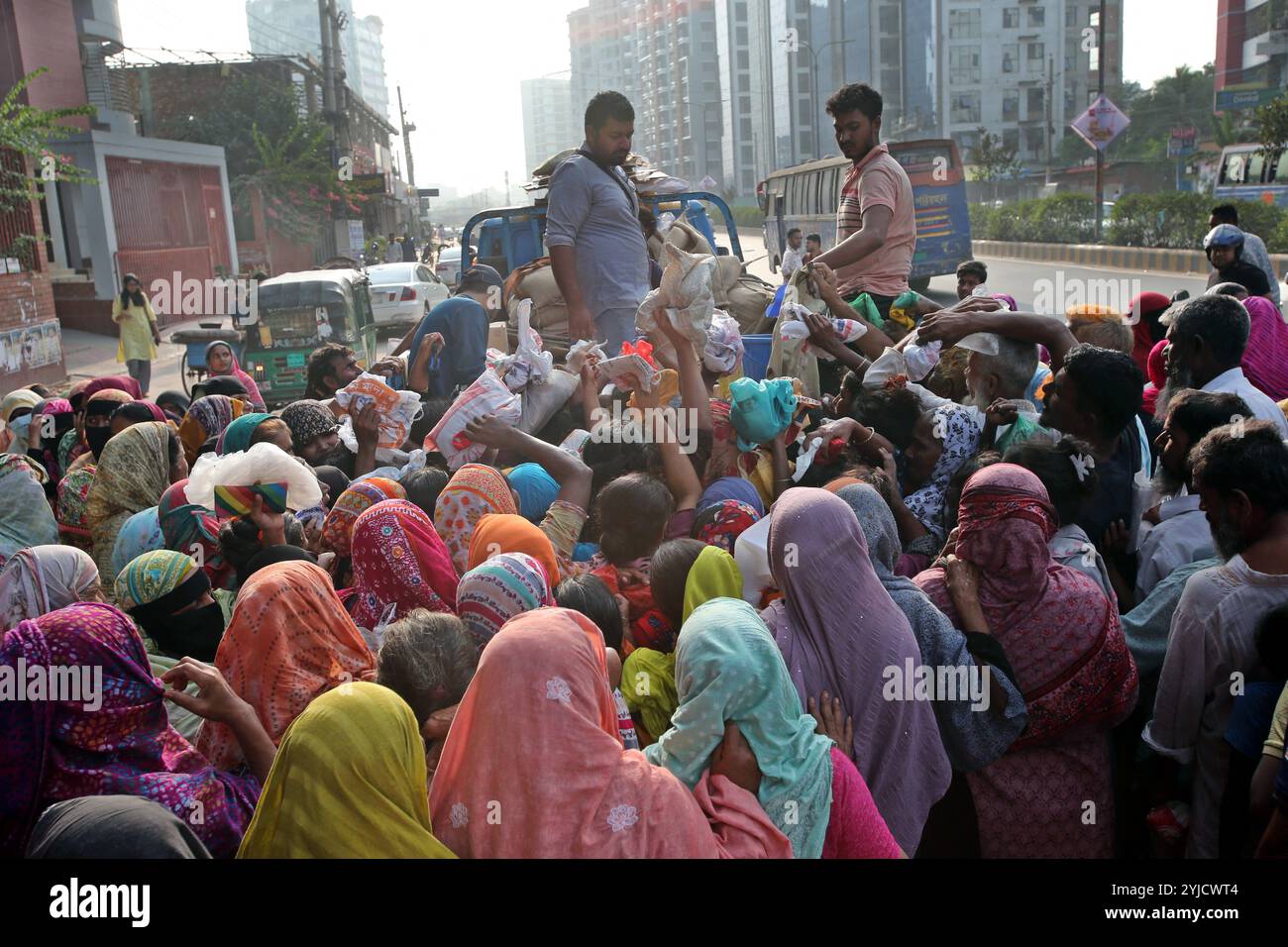 Dhaka, India. 14th Nov, 2024. People stand in a queue to buy government-subsidized food in Dhaka ...