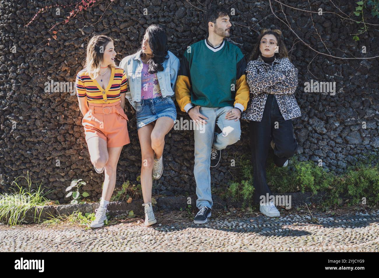 Stylish group of Gen Z friends showing individual fashion styles while ...