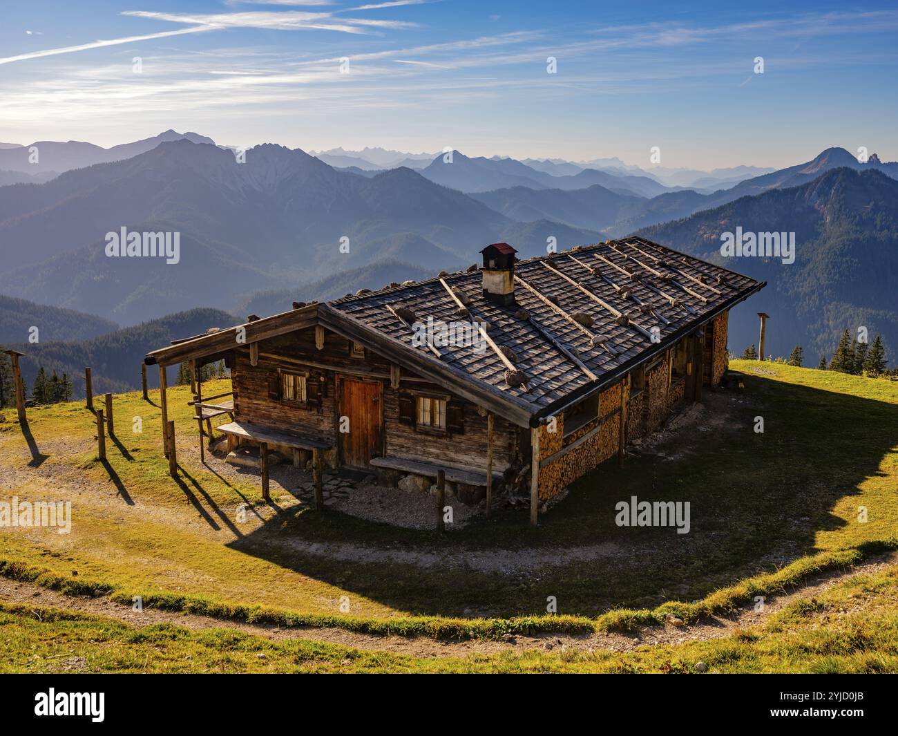 Wildfeldalm in front of alpine panorama, silhouette of mountain ranges ...