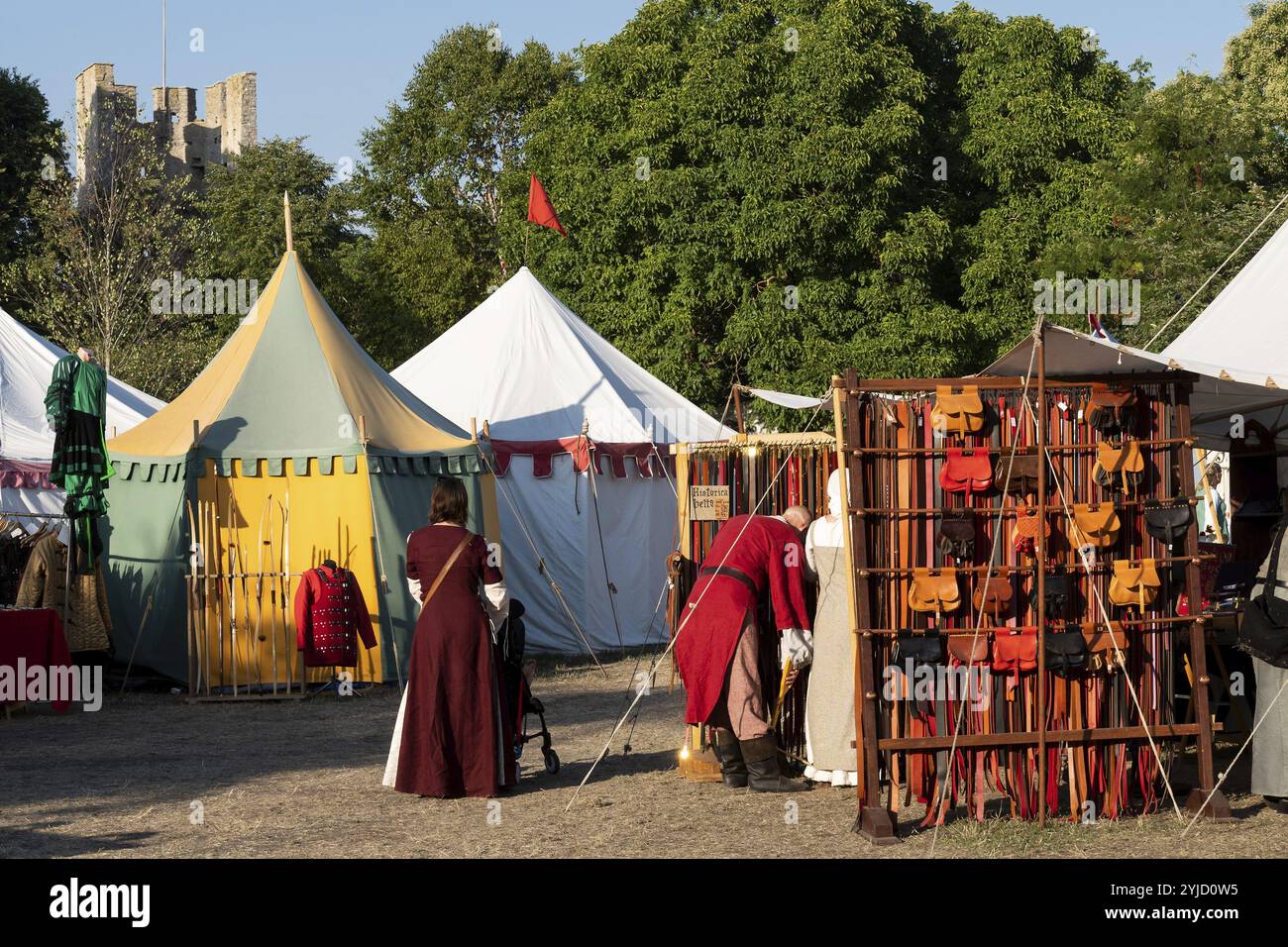 Colourful round tents, people in medieval clothing, medieval market ...