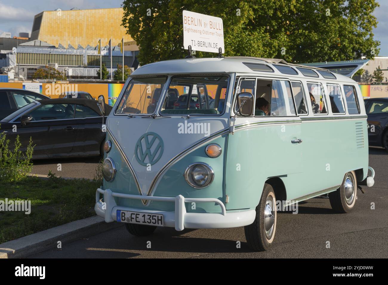 Mint green VW vintage bus on a street in Berlin, retro style, city tour ...