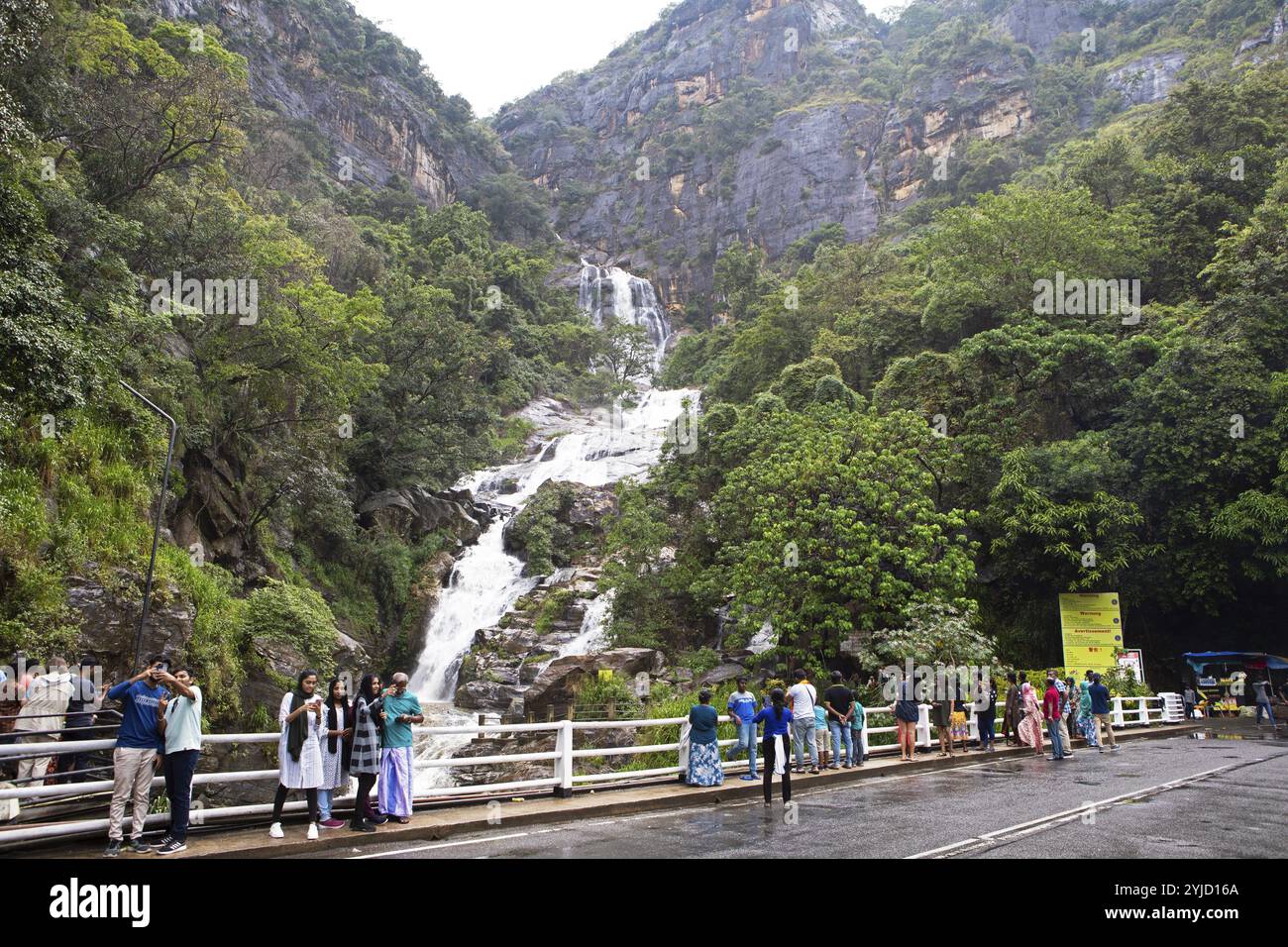 Sri Lankan woman and men at the Rawana waterfalls, Uva province, Sri ...