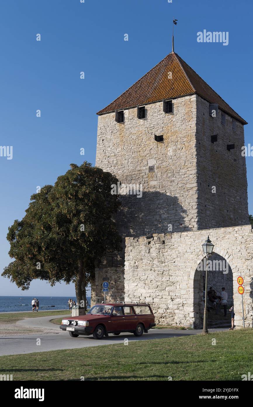 Old Volvo in front of a medieval defence defence tower, city wall ...