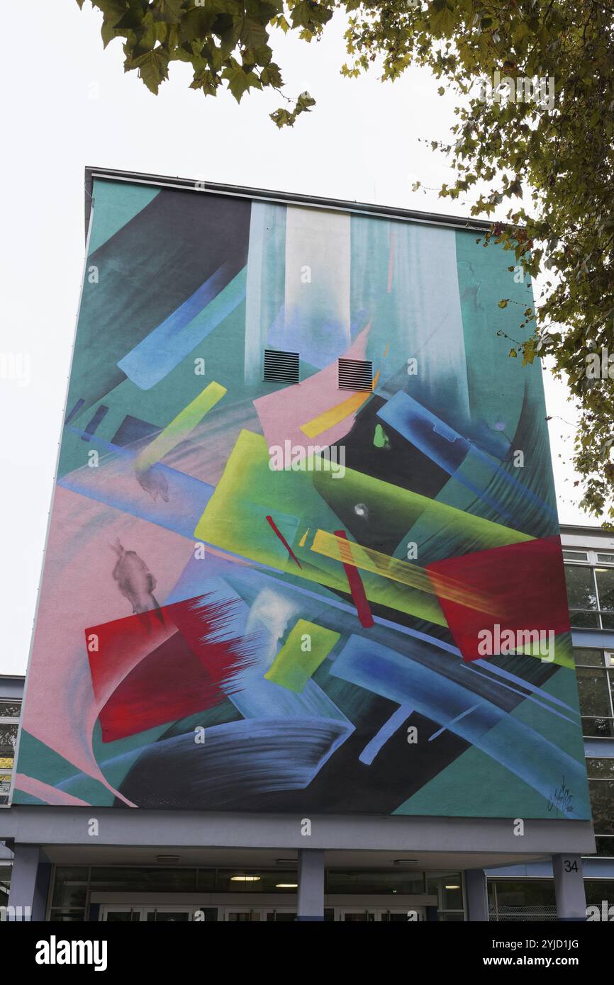 Abstract mural in bright colours on a school building, by graffiti ...