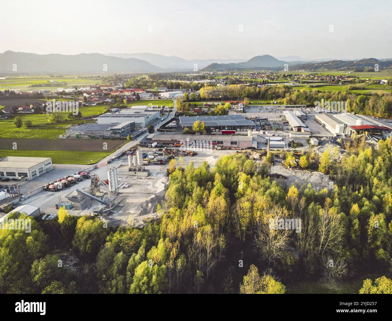Aerial view of a factory, warehouse facility in the suburbs with roof ...