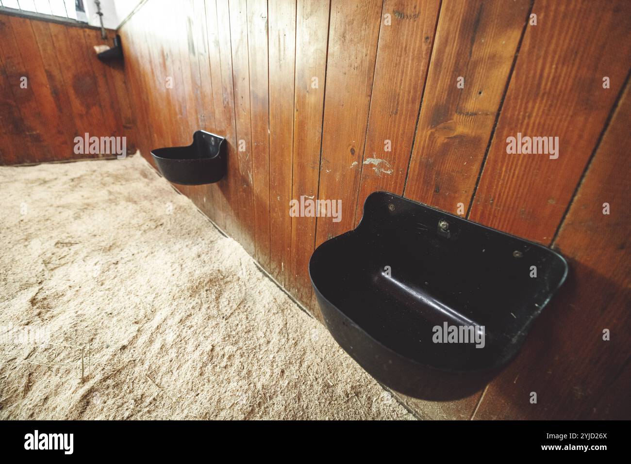Empty stable, no horses inside the stables. Clean and empty horse boxes ...