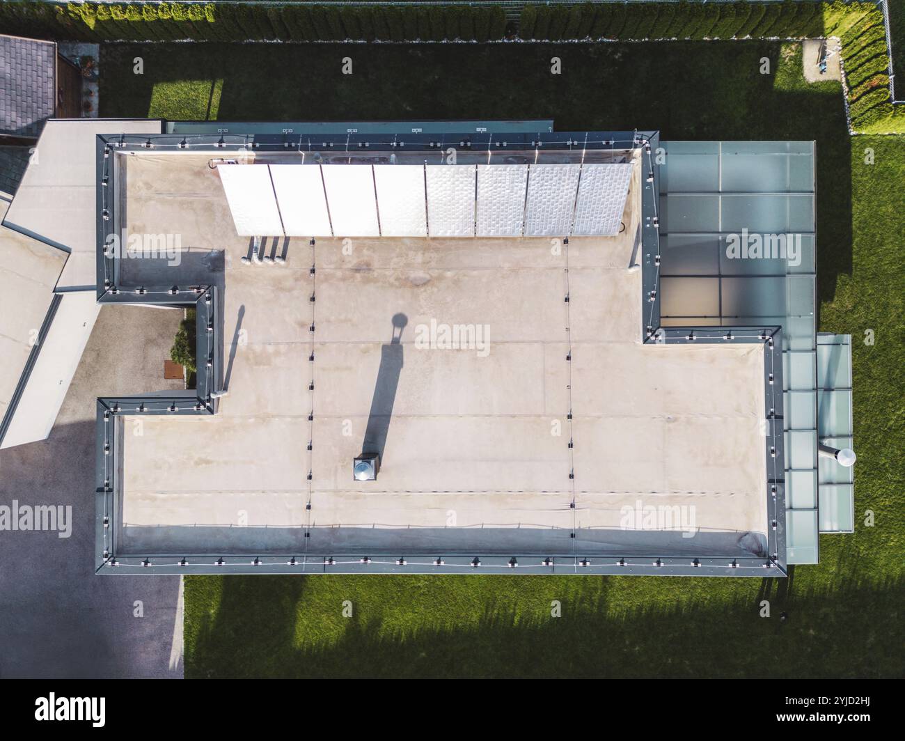 Aerial view of a modern house with solar panels on the roof top. Modern ...