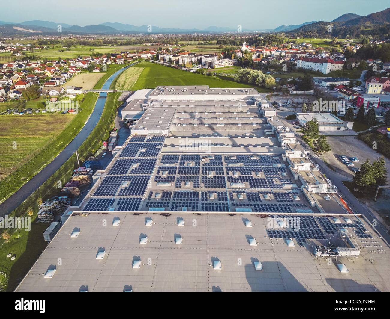 Aerial view of a factory, warehouse facility in the suburbs with roof ...