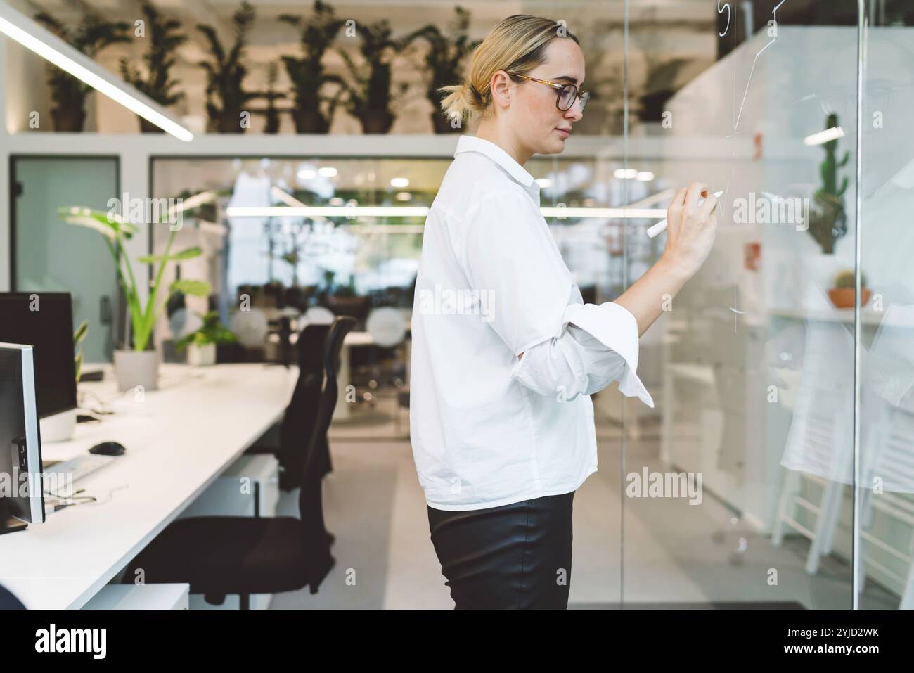 Office full of caucasian business people of different ages working at ...