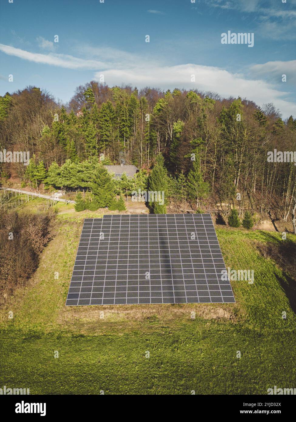 Aerial view of solar panels. Drone point of view, flying over a hill in ...