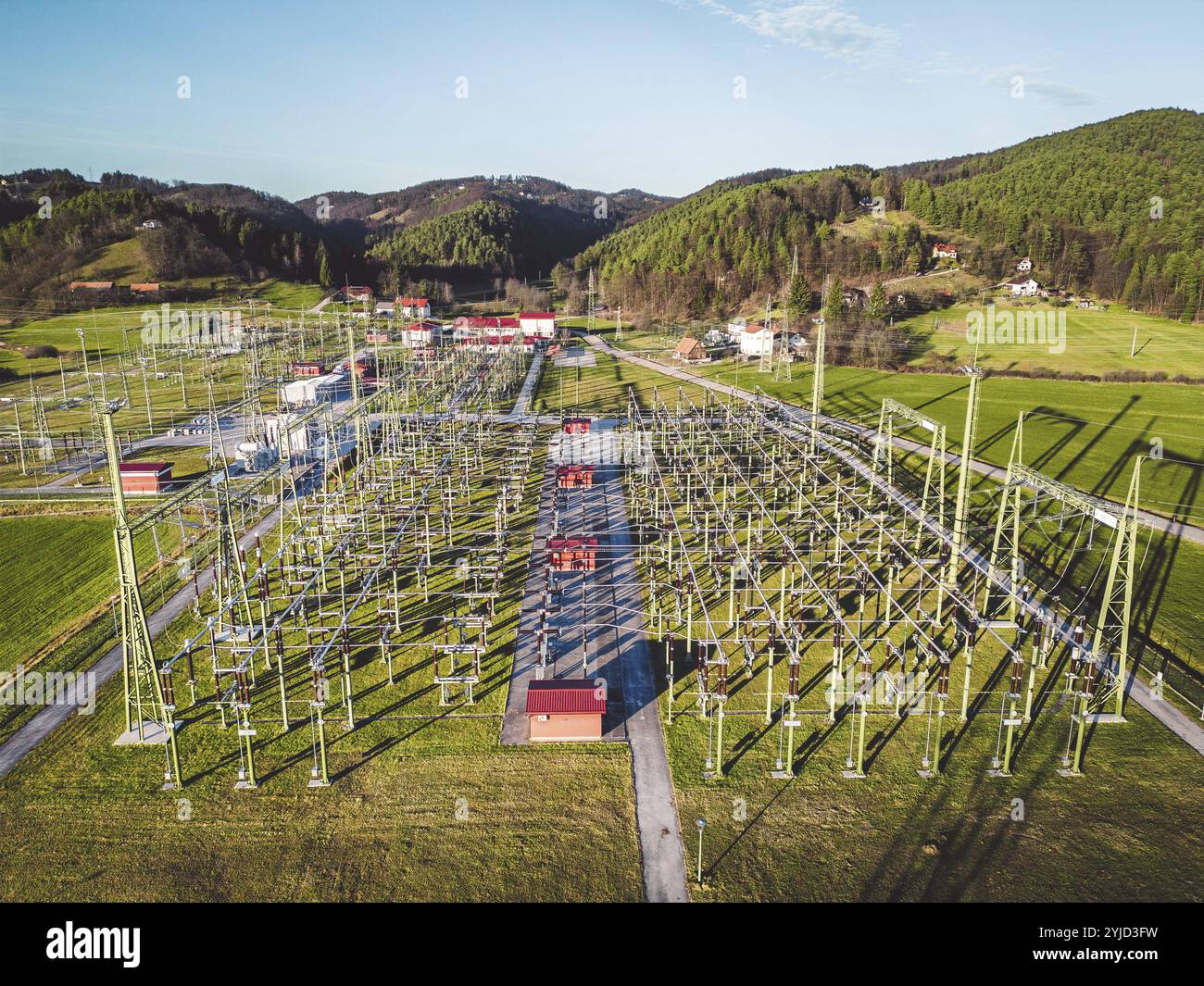 Electrical power substation in the country side of Slovenia. Fields and ...