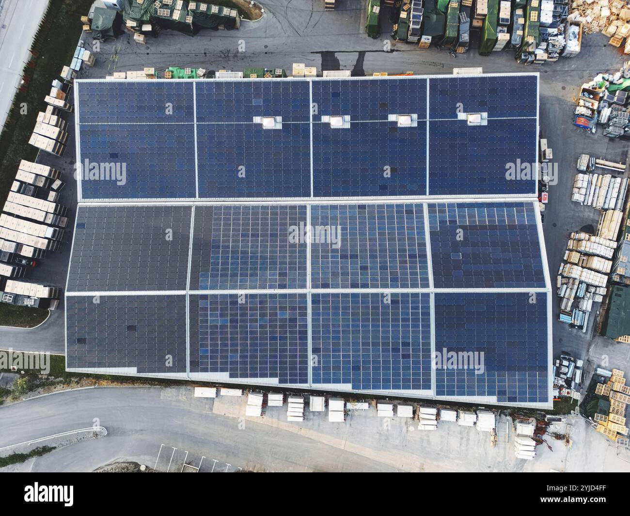 Aerial view of a factory, warehouse facility in the suburbs with roof ...
