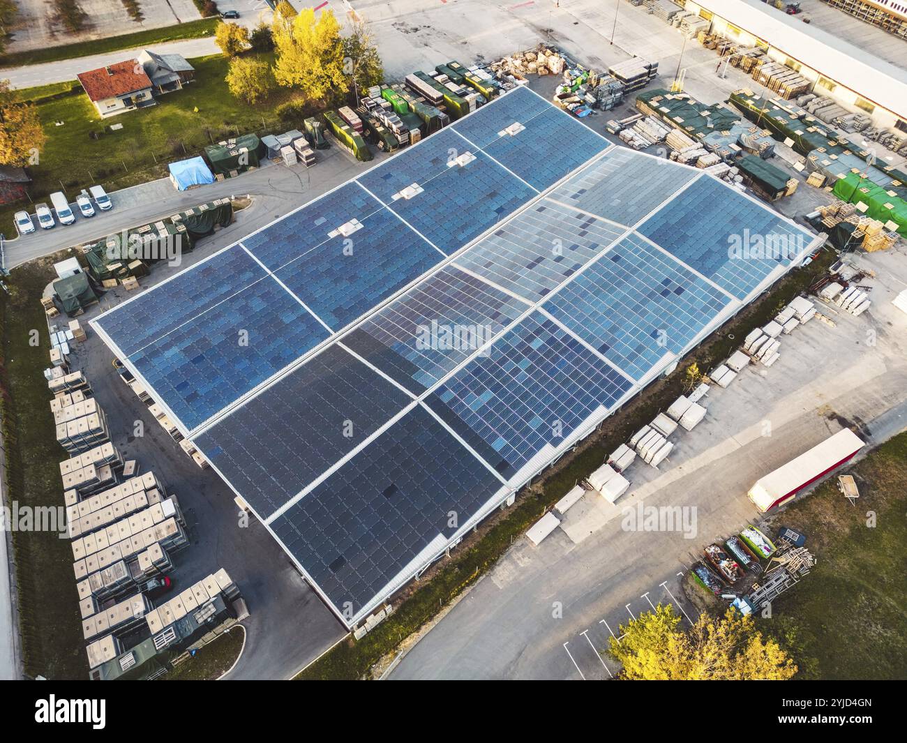 Aerial view of a factory, warehouse facility in the suburbs with roof ...