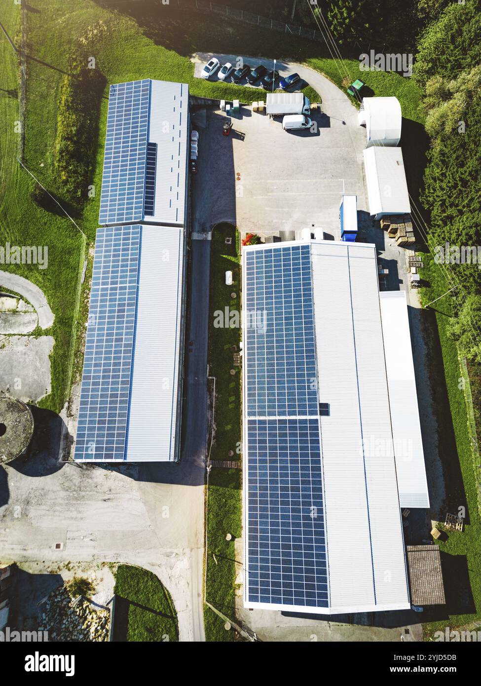 Solar panels installed on a roof of a large industrial building or a ...