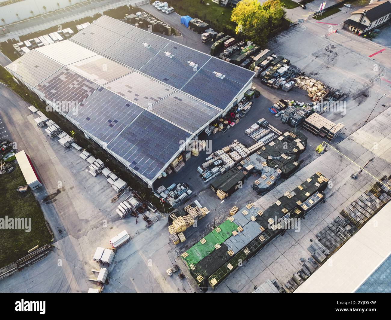 Aerial view of a factory, warehouse facility in the suburbs with roof ...
