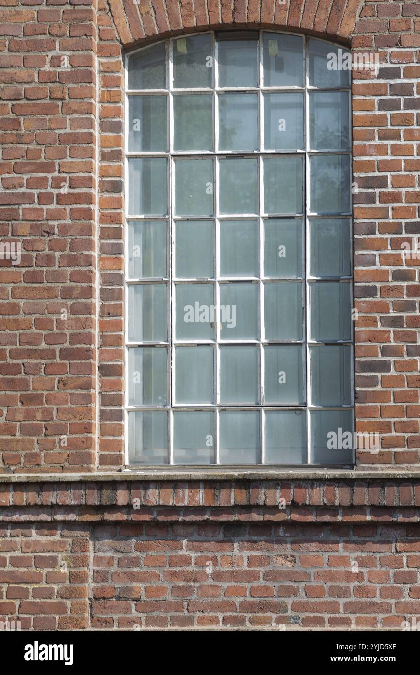 Close-up of a classic mullioned window in a brick barrel vault, Bottrop ...