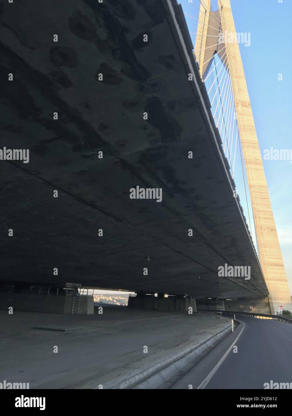 View from beneath a modern concrete bridge with visible architecture ...