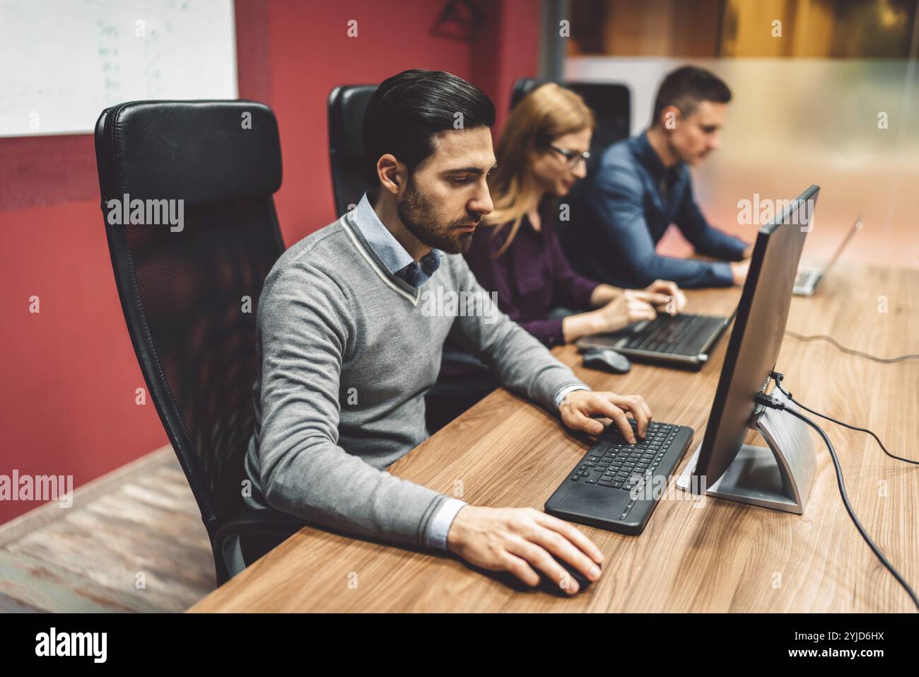 Start up company, young caucasian business people at work ...