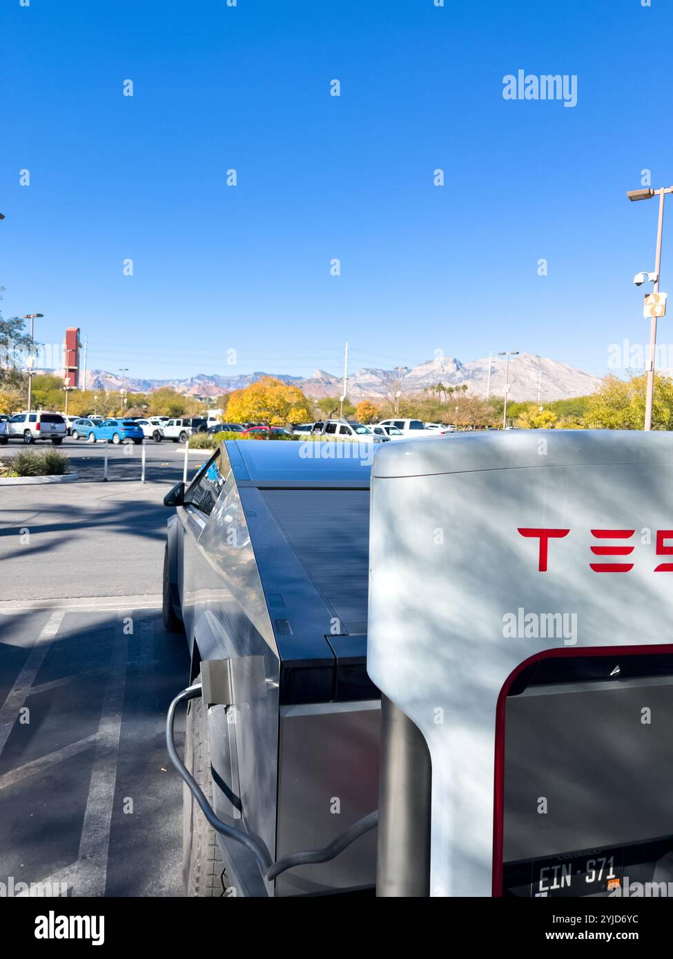 Futuristic Tesla Cybertruck Charging at Supercharger Station Stock ...