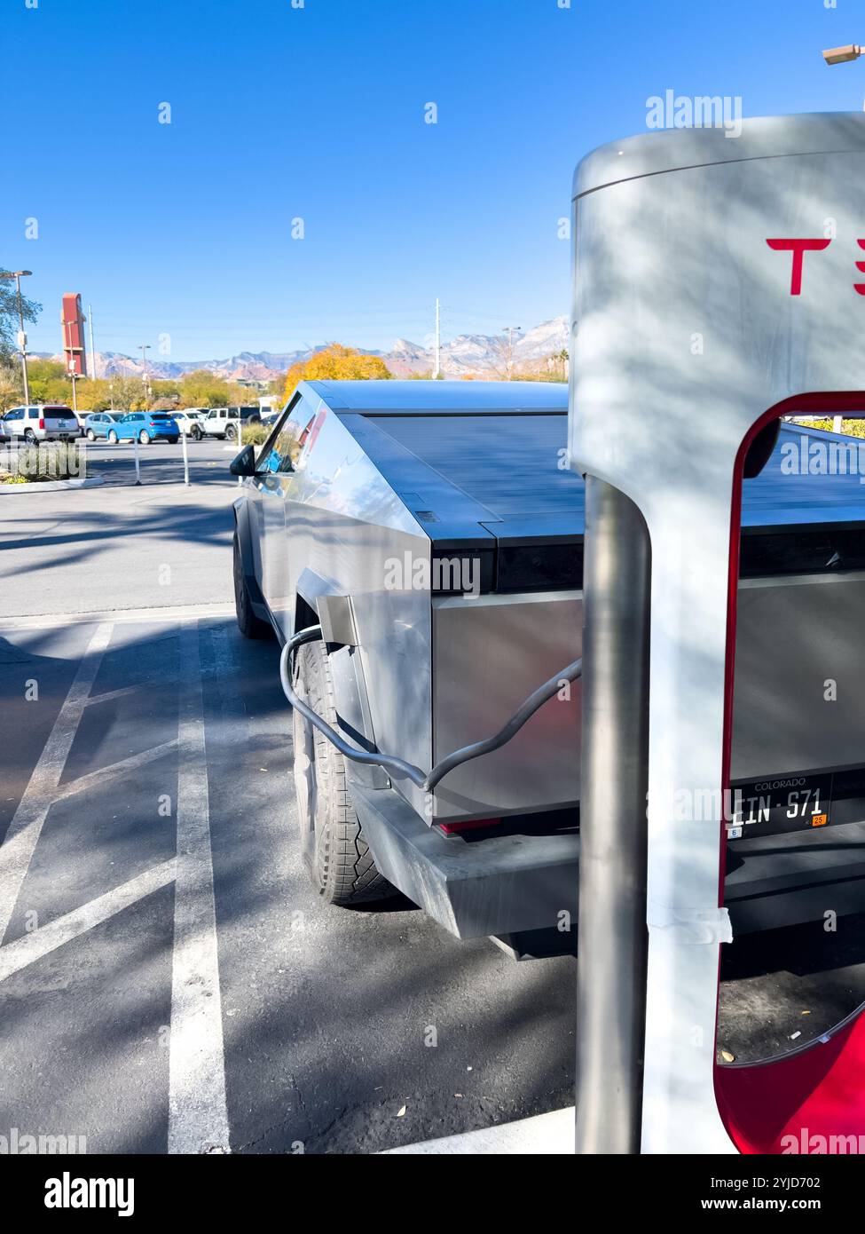 Futuristic Tesla Cybertruck Charging at Supercharger Station Stock ...